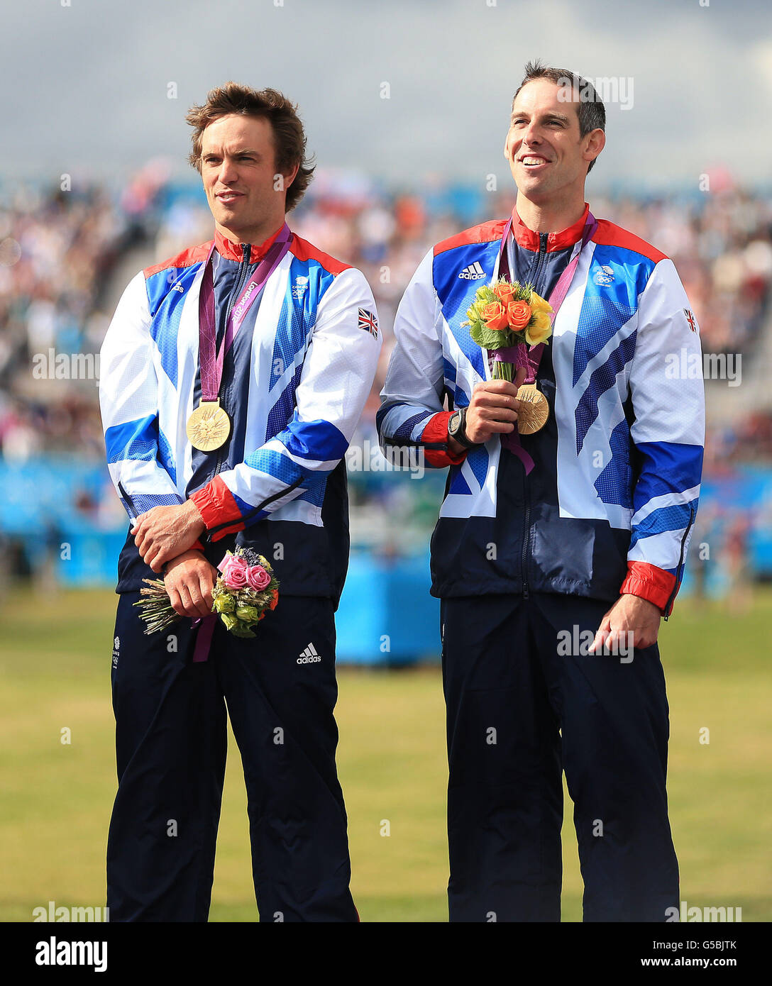 Great Britain's Tim Baille (left) and Etienne Stott receive their gold ...