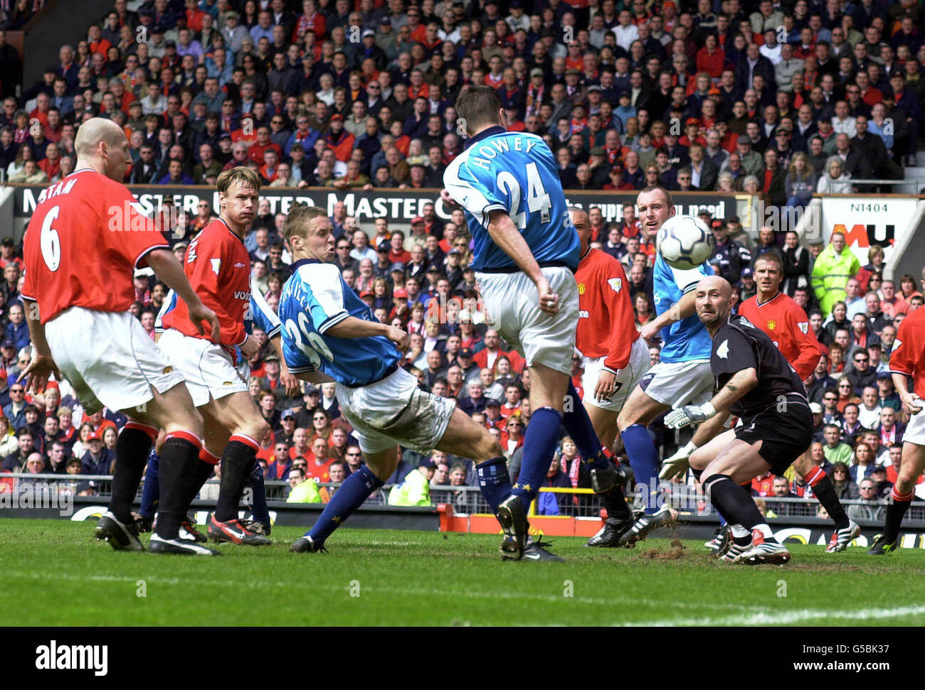 Steve Howie (centre) of Manchester City beats Manchester United ...