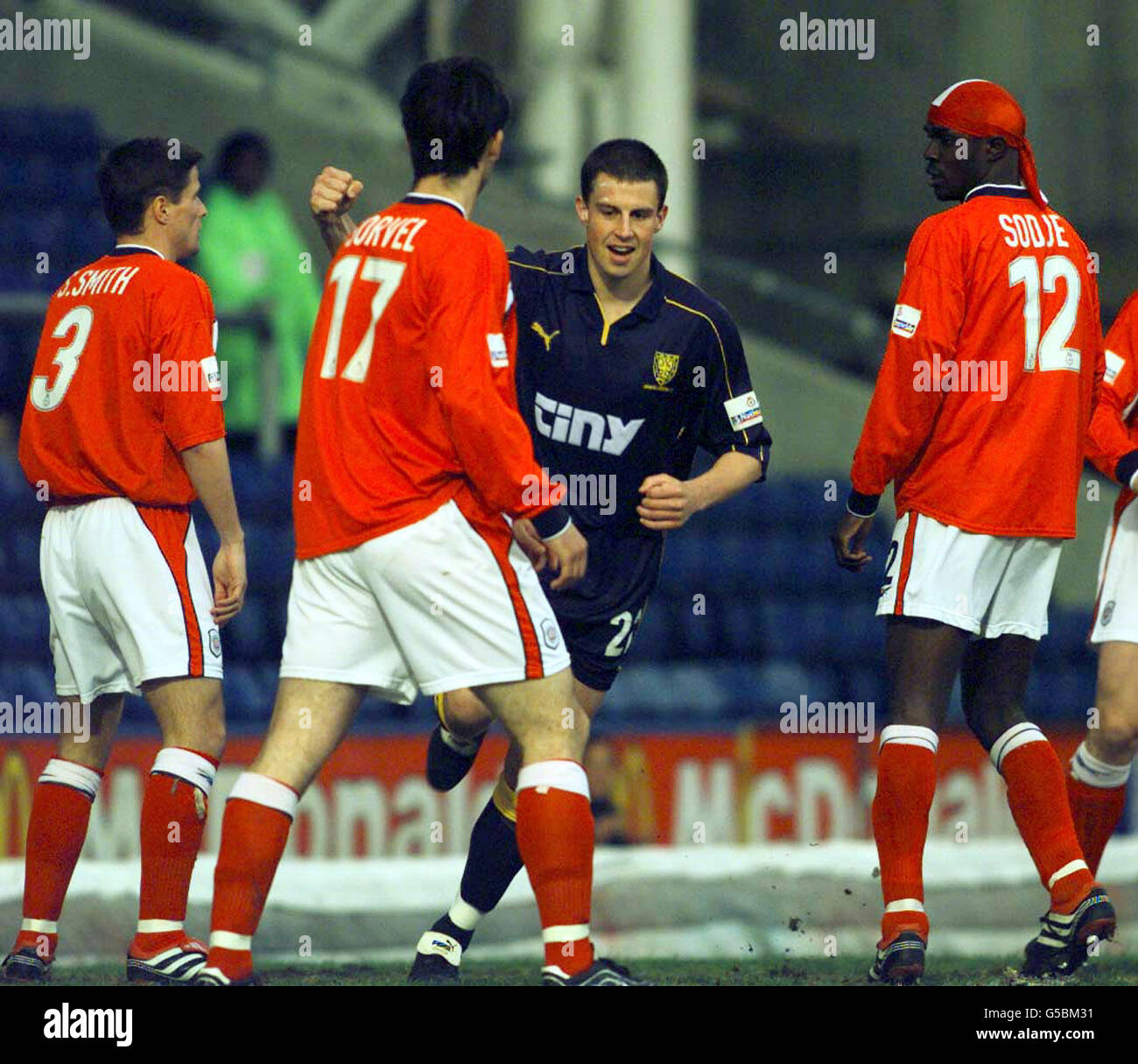 Wimbledon's Chris Willmott (second right) turns to celebrate after ...