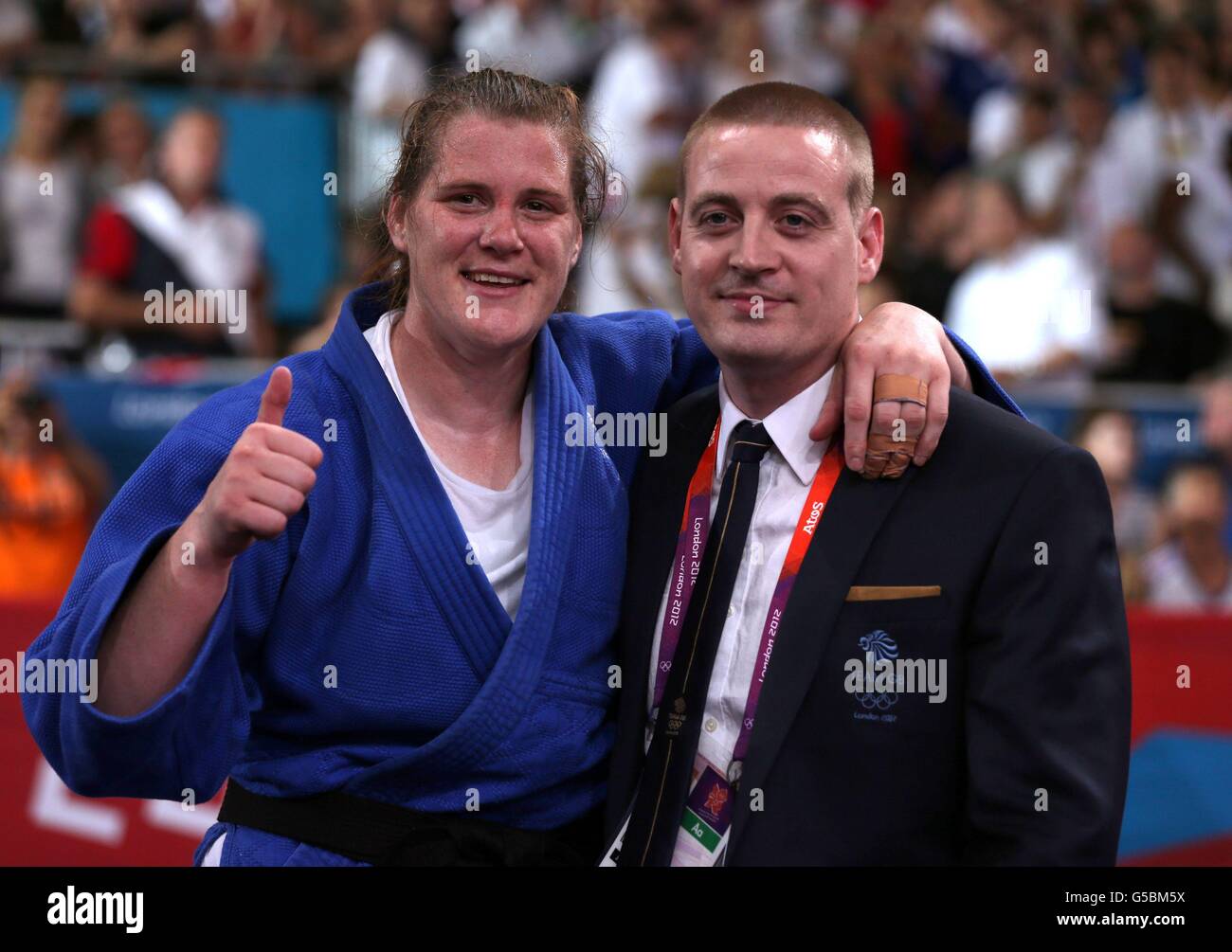 Great Britain's Karina Bryant celebrates with her coach Luke Preston ...