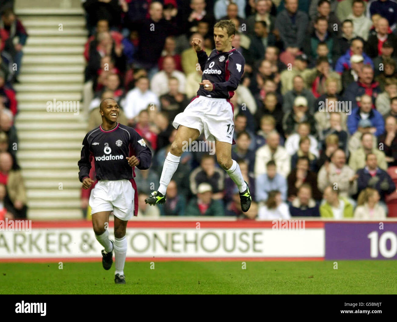 Manchester United's Phil Neville (right) celebrates his goal with team ...