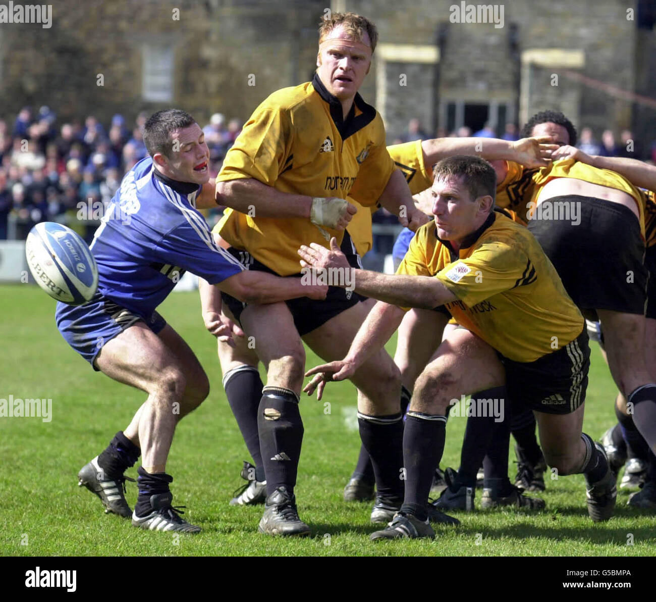 Newcastle's Gary Armstrong (right) gets his pass away from Bath's ...