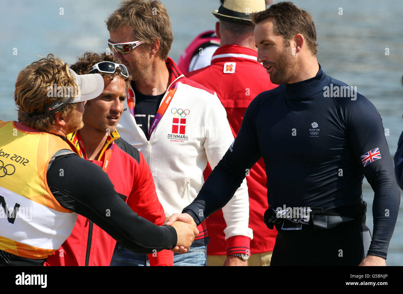 Great Britain's Gold medalist Finn sailor Ben Ainslie congratulates ...