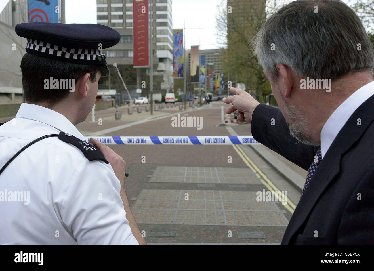 A man speaks to a police officer at a police cordon near the London ...