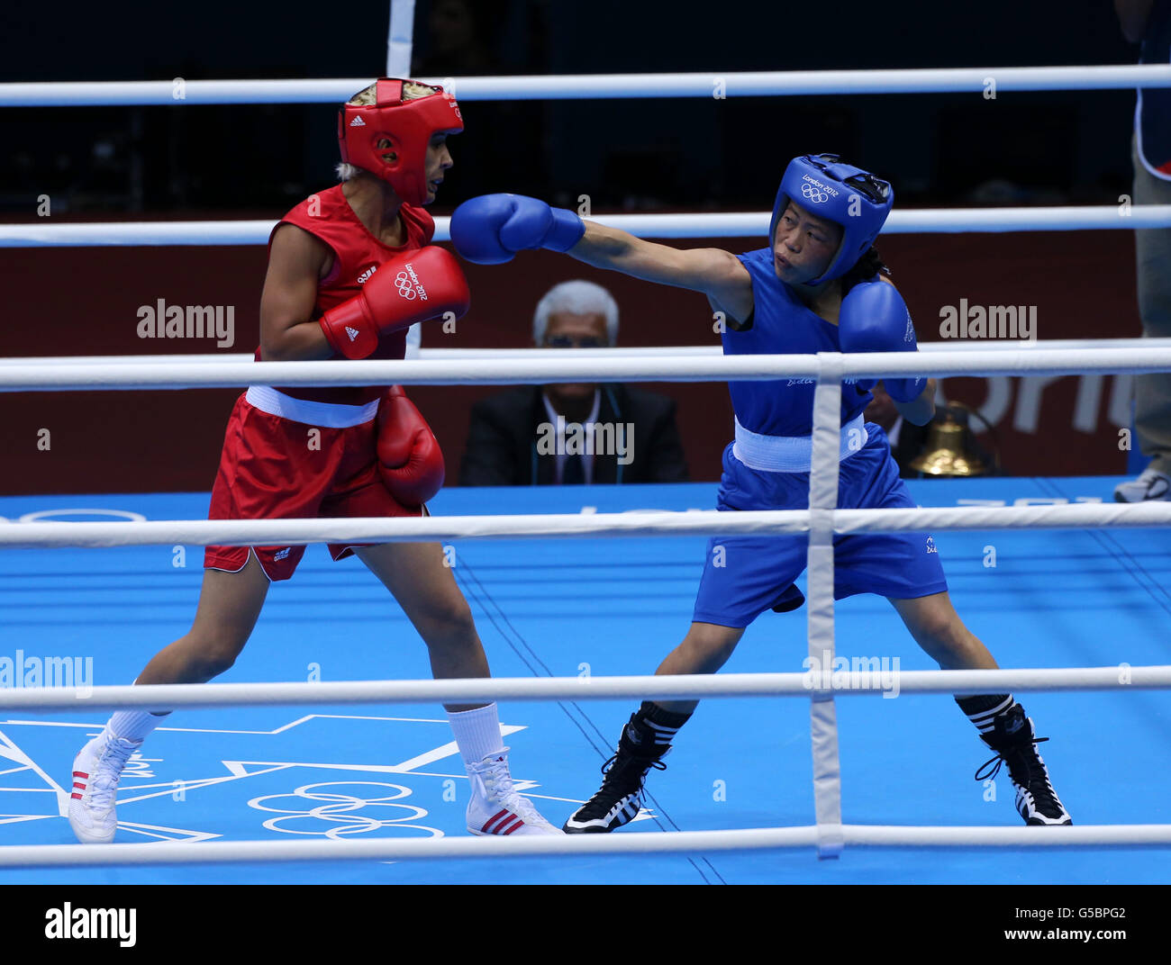 India's Women boxer Chungneijang Mery Kom Hmangte (blue) during her win ...