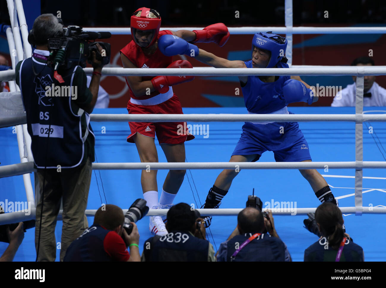 India's Women boxer Chungneijang Mery Kom Hmangte (blue) during her win ...