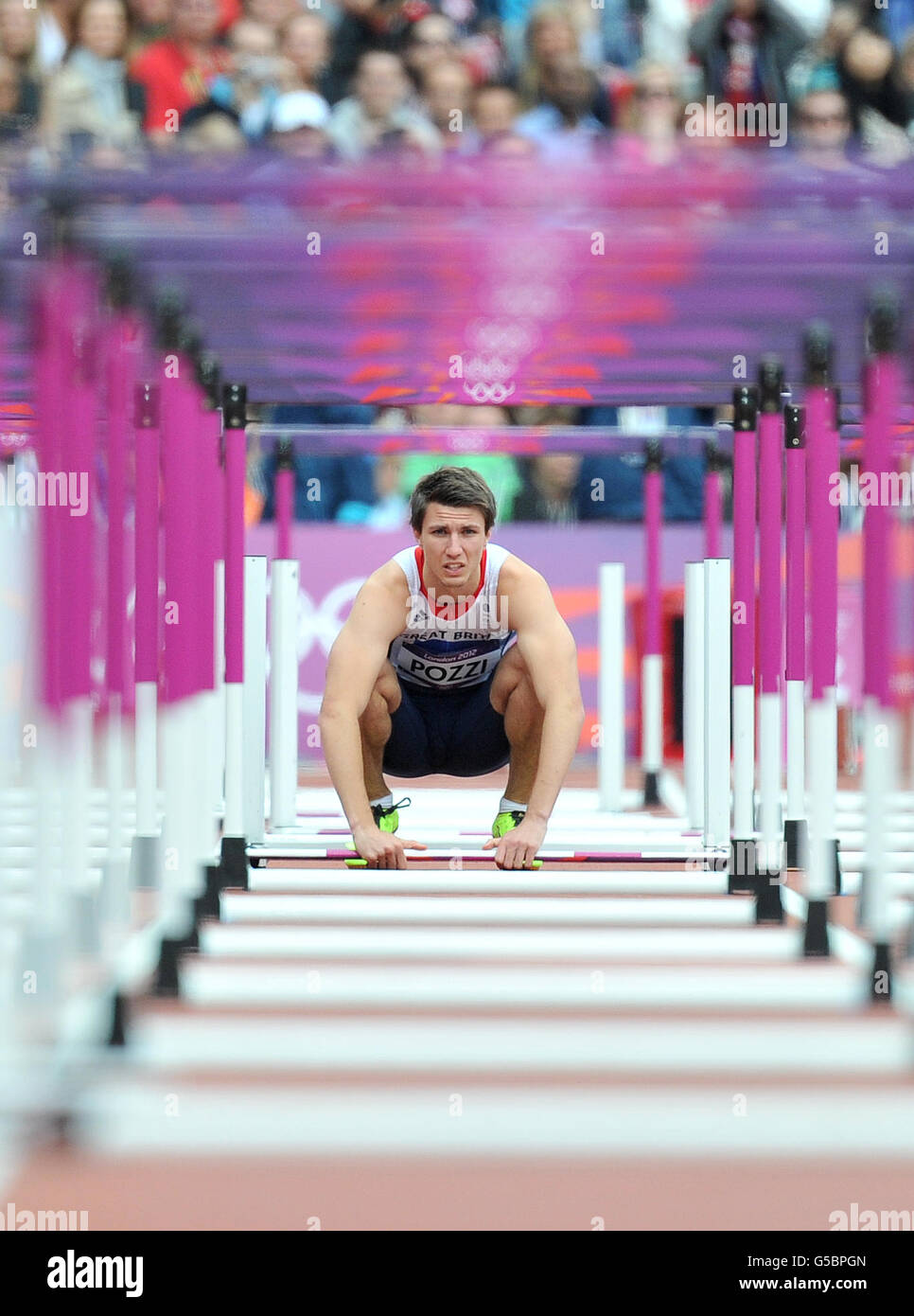Great Britain's Andrew Pozzi crouches on the track after failing to ...