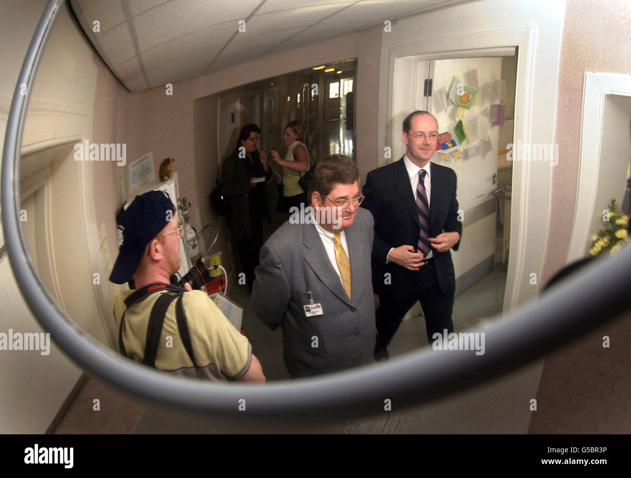 Scottish National Party Leader John Swinney (R) is given a tour of the ...