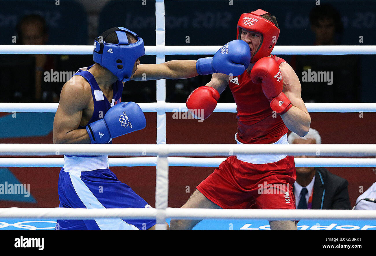 Great Britain's Thomas Stalker (red) in action against Mongolia's Munkh ...