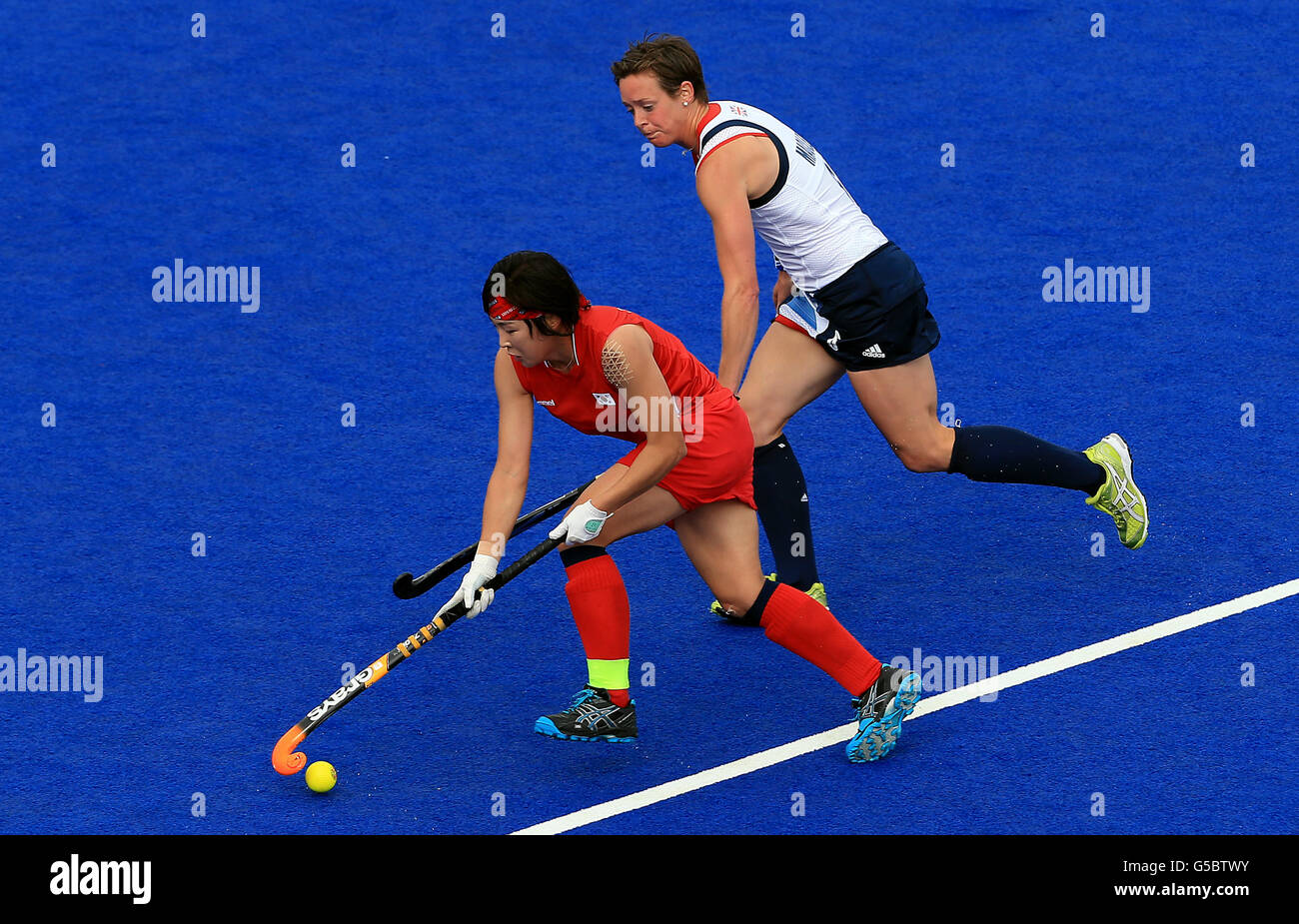 Great Britain's Hannah Macleod and South Korea's Seonok Lee battle for ...