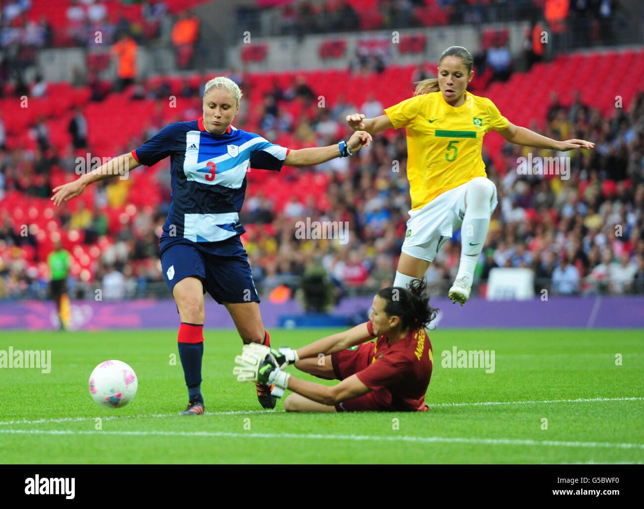 Great Britain's Stephanie Houghton rounds Brazil's goalkeeper Andreia ...