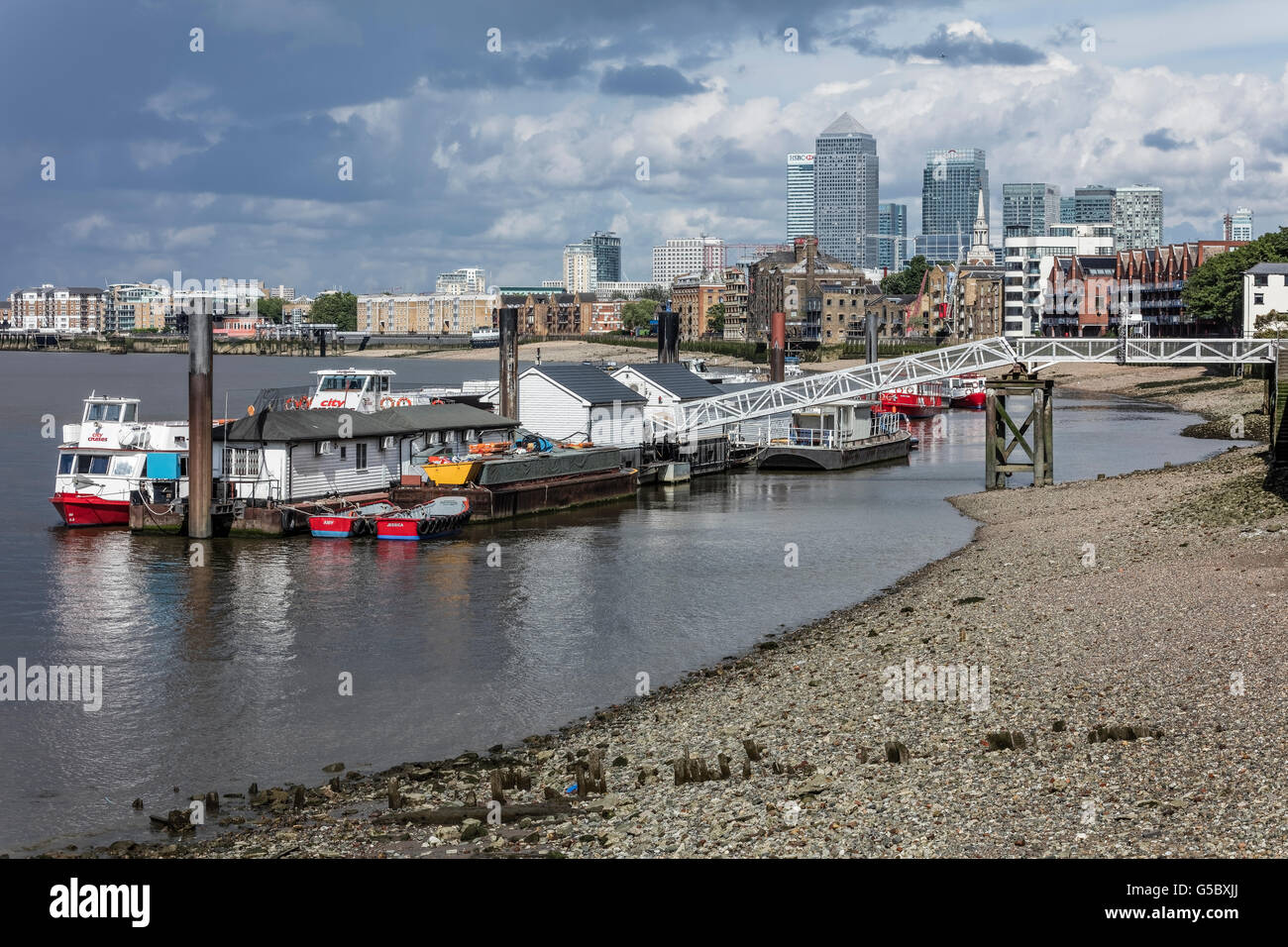 River Thames at low tide in South London with the buildings of Canary ...