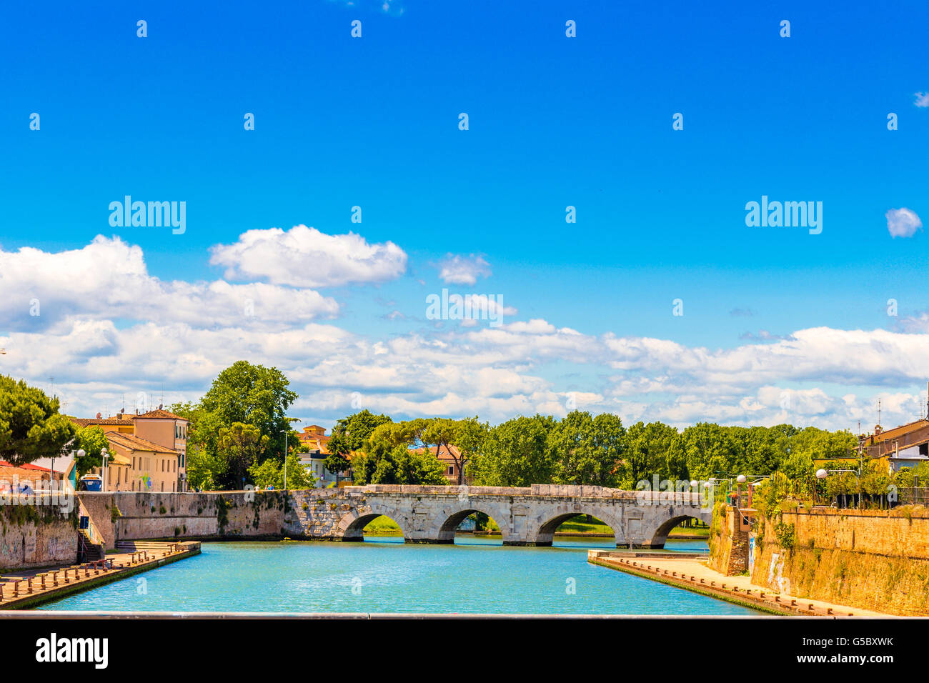 clear water under the arches of the Roman bridge of Augustus Stock ...