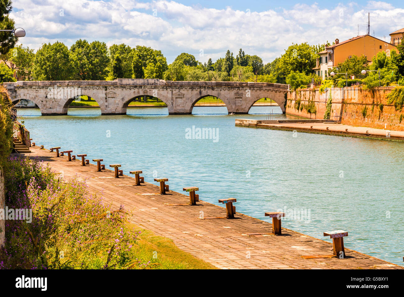 clear water under the arches of the Roman bridge of Augustus Stock ...