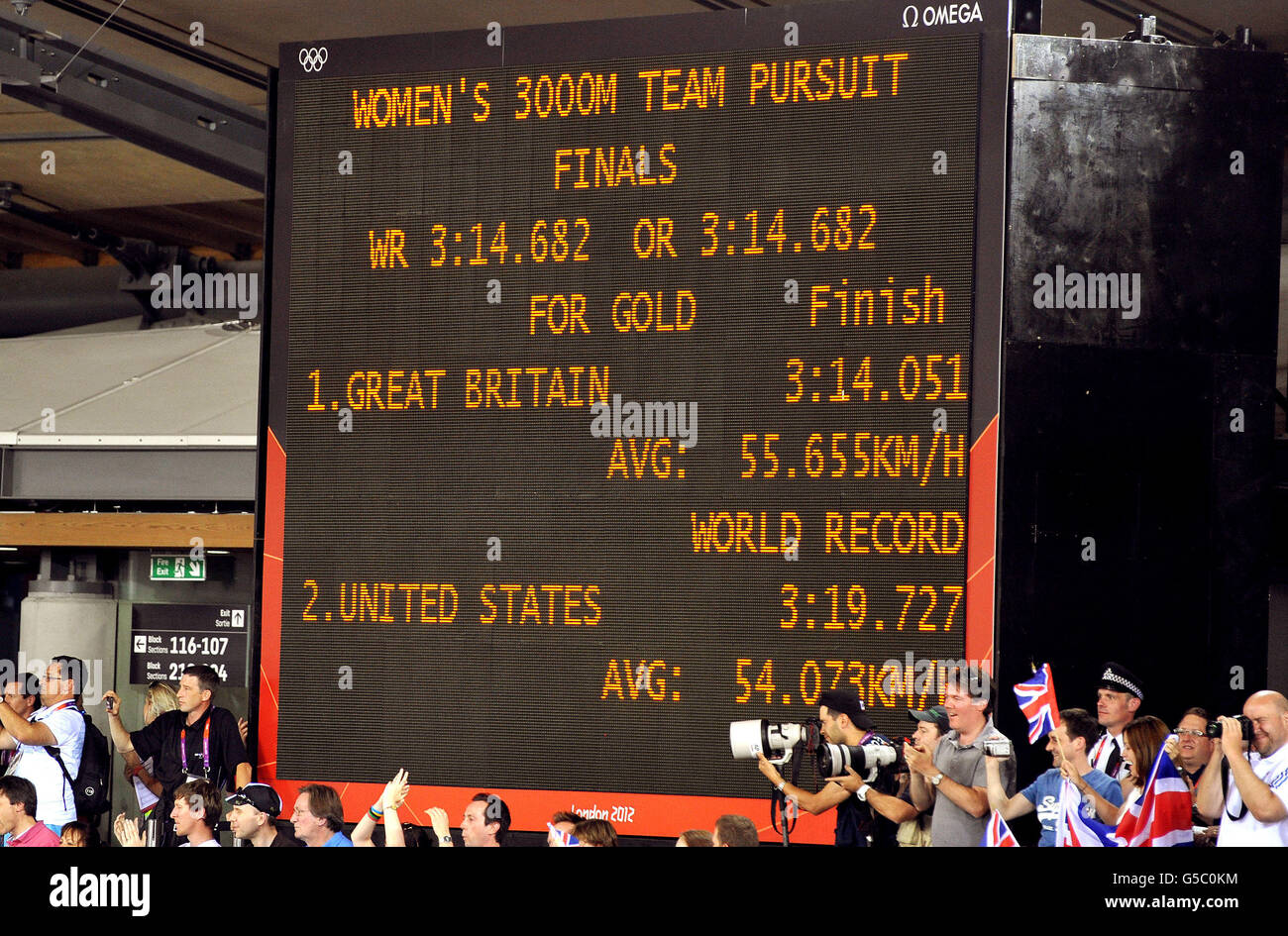 The scoreboard displays the Great Britain team's winning time in the ...