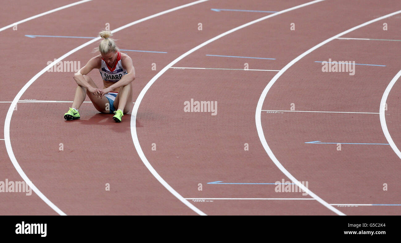 Great Britain's Lynsey Sharp sits on the track after missing out on ...