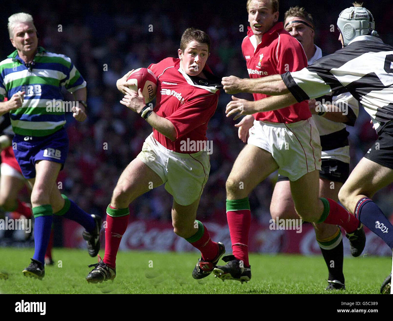 Wales' Shane Williams is collared by Barbarians Tom Bowman (right ...