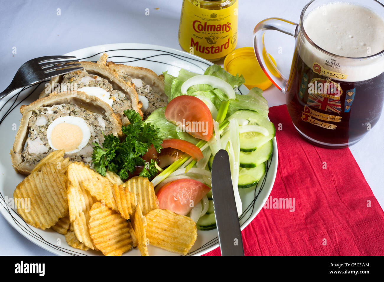 A plated lunch of homemade Gala Pie, Mixed Salad, served with a pint of ...