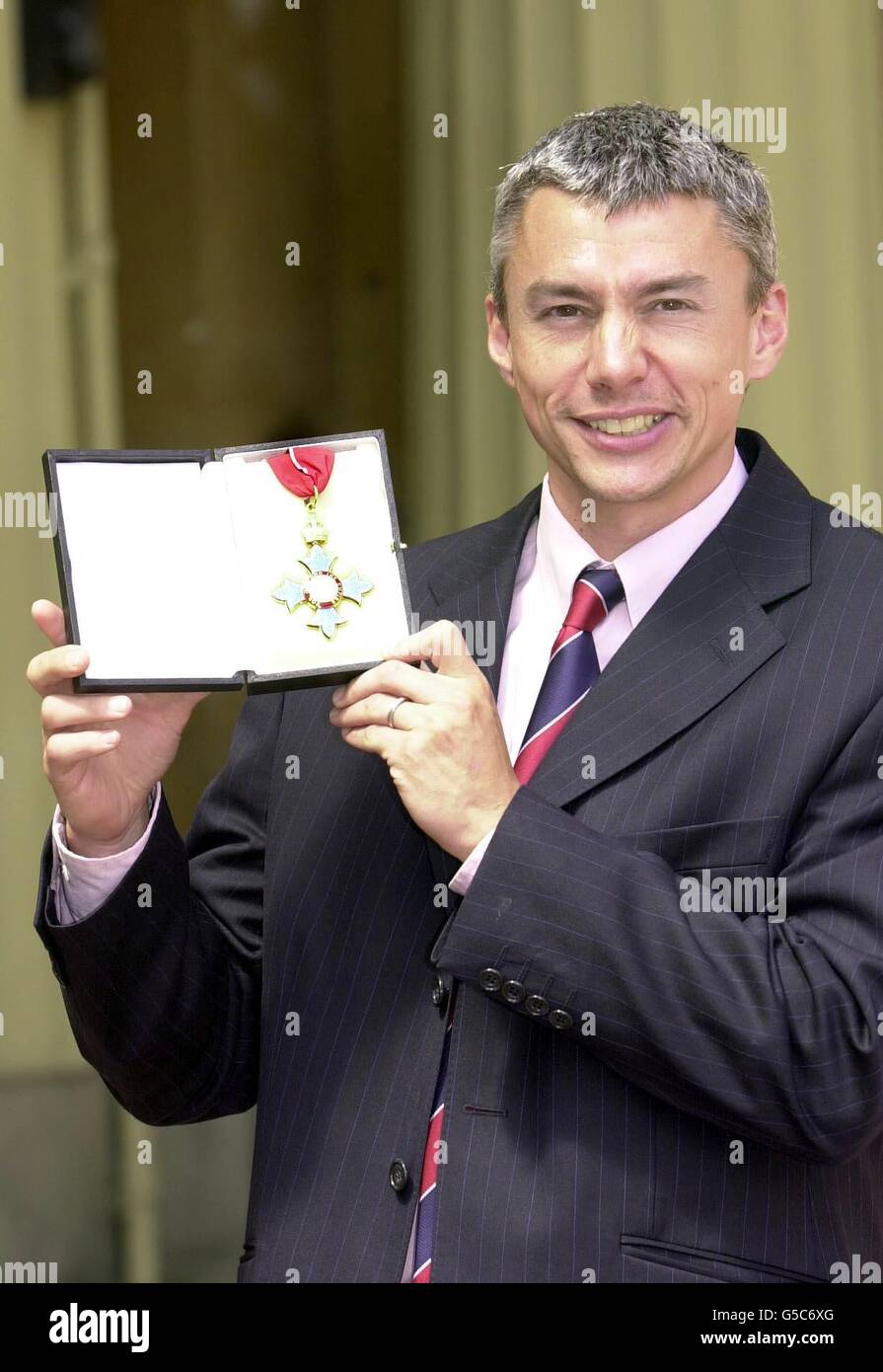 Triple-jumper Jonathan Edwards after he received a CBE from Britain's ...