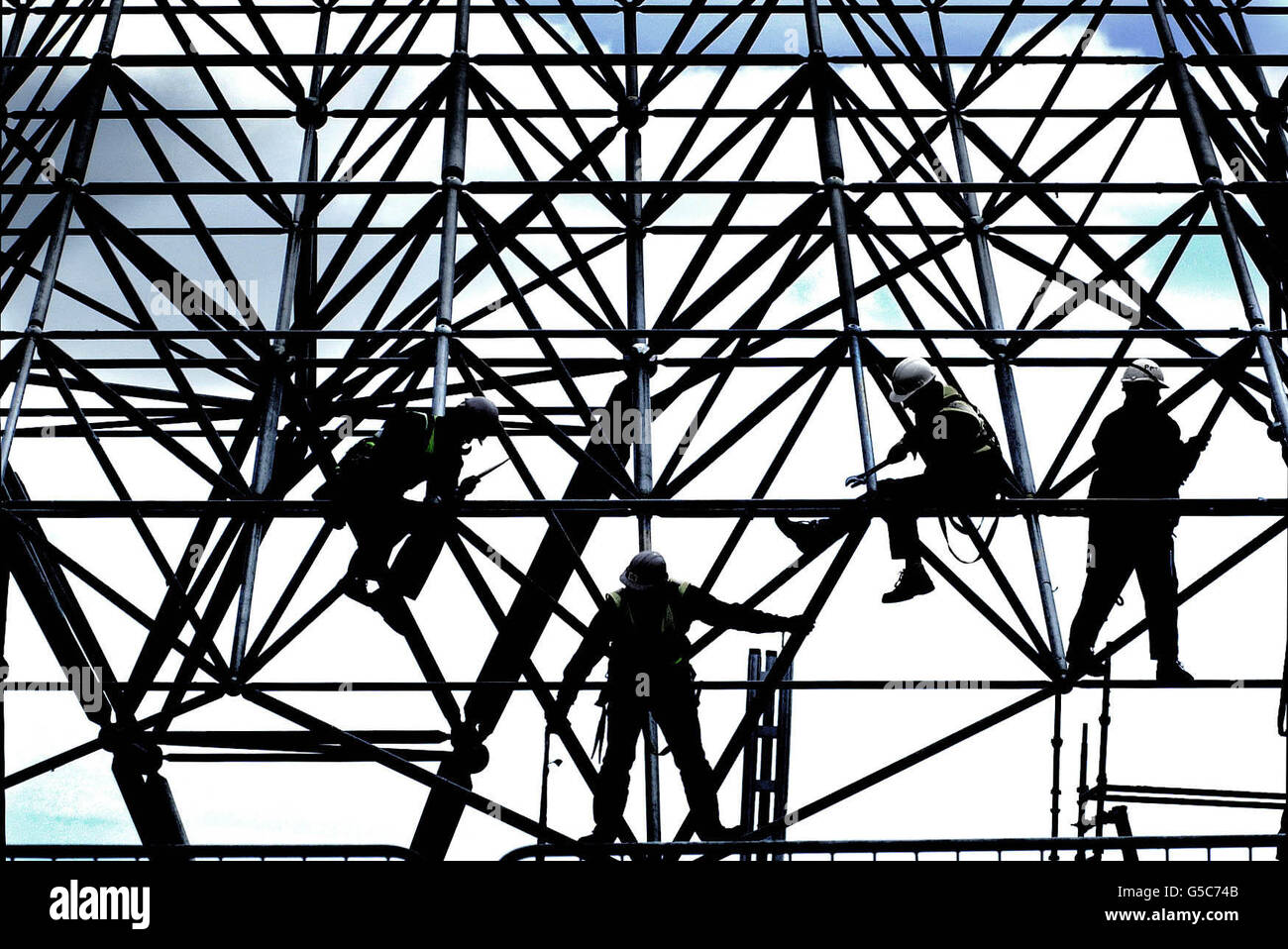 Workmen, in the early stages of building the arena for the world famous ...