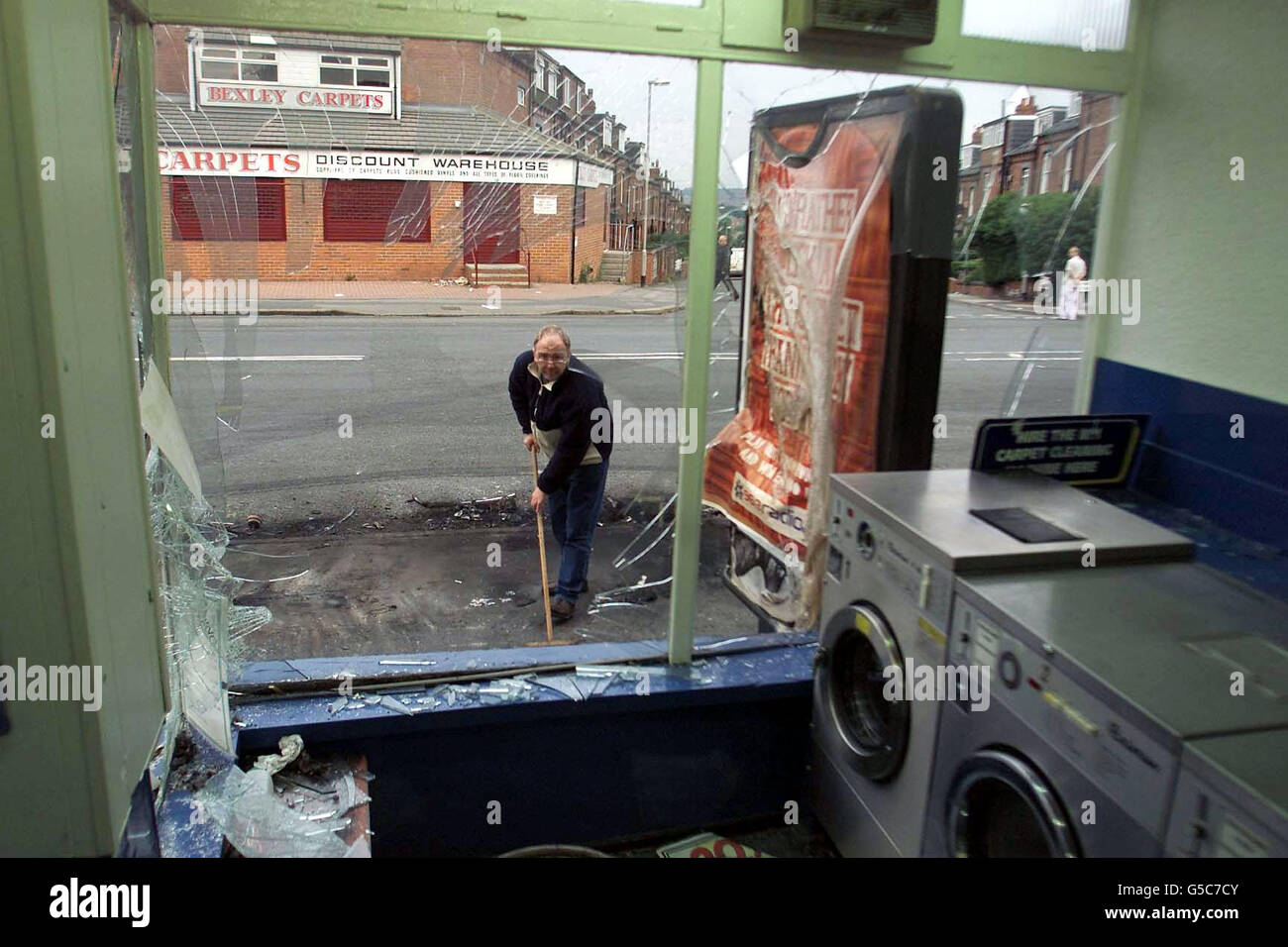 The clean-up gets underway after the night's riots in the Harehills ...