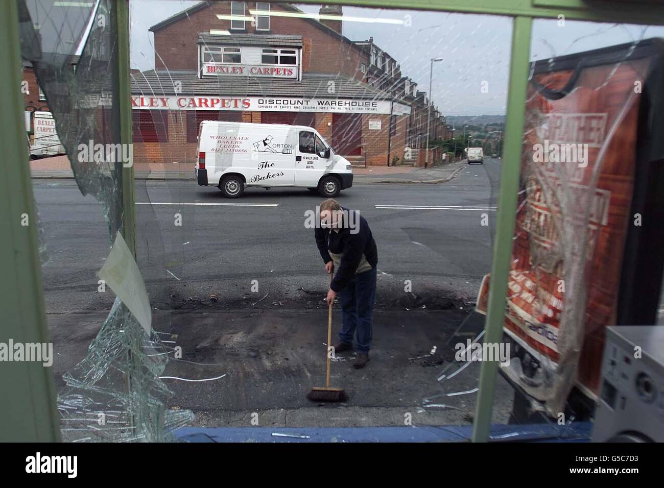The clean-up gets underway after the night's riots in the Harehills ...