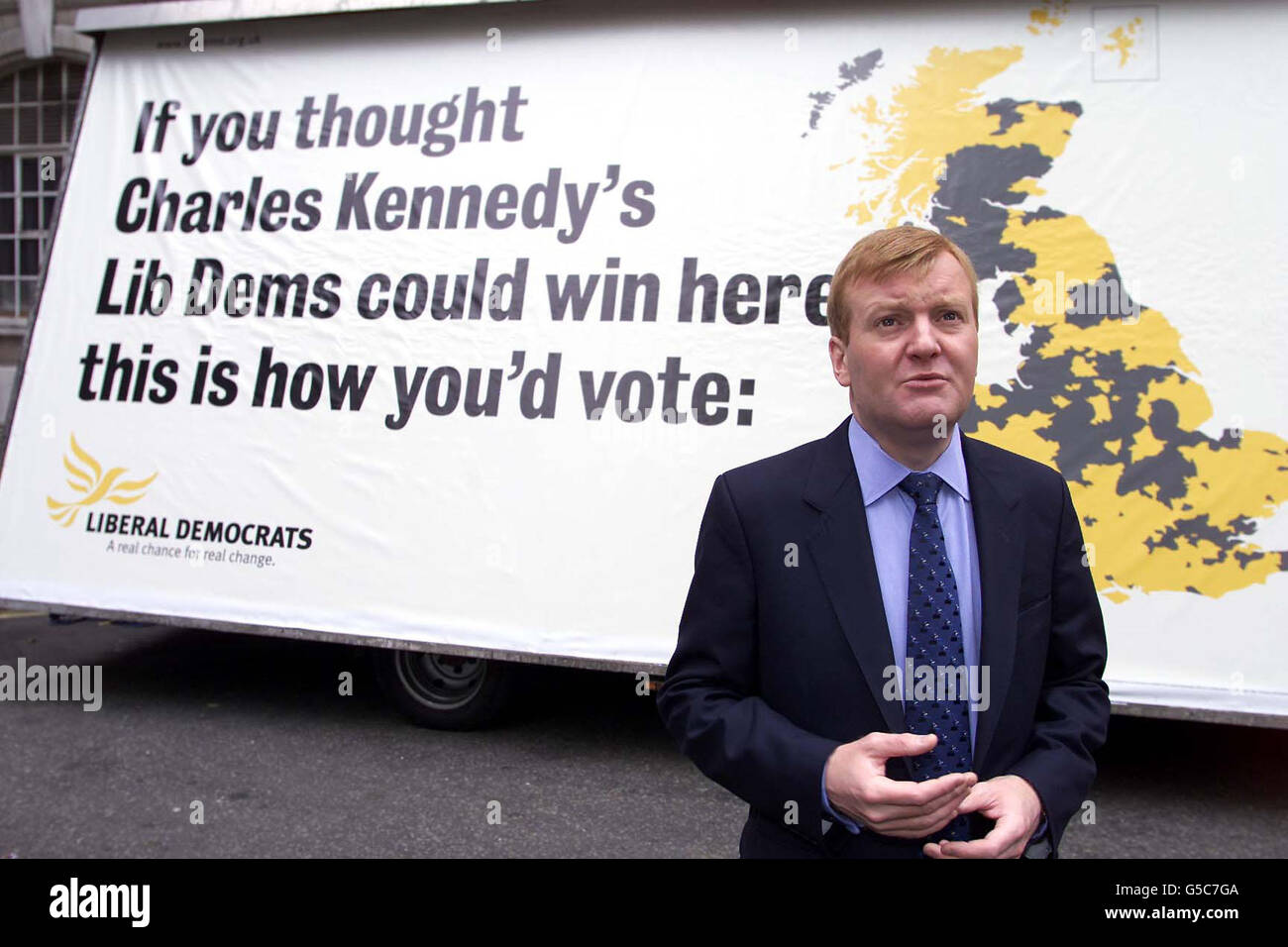 Liberal Democrat leader Charles Kennedy in front of an election ...