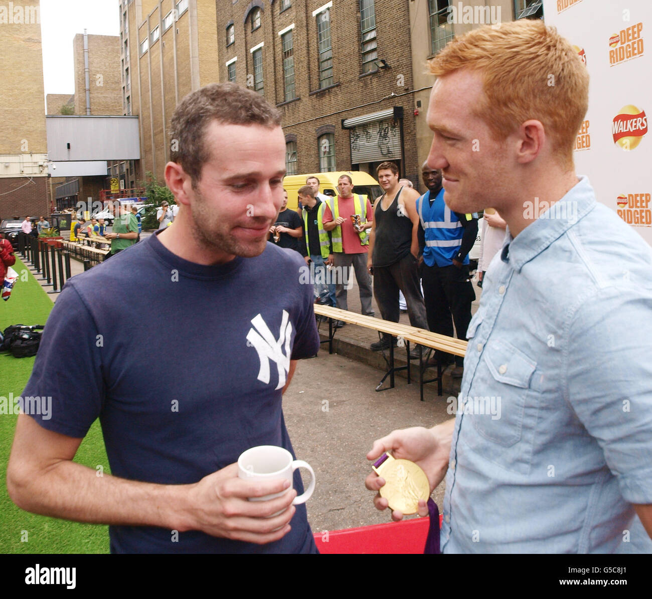 Britain's Olympic long-jump gold medal winner Greg Rutherford and his ...