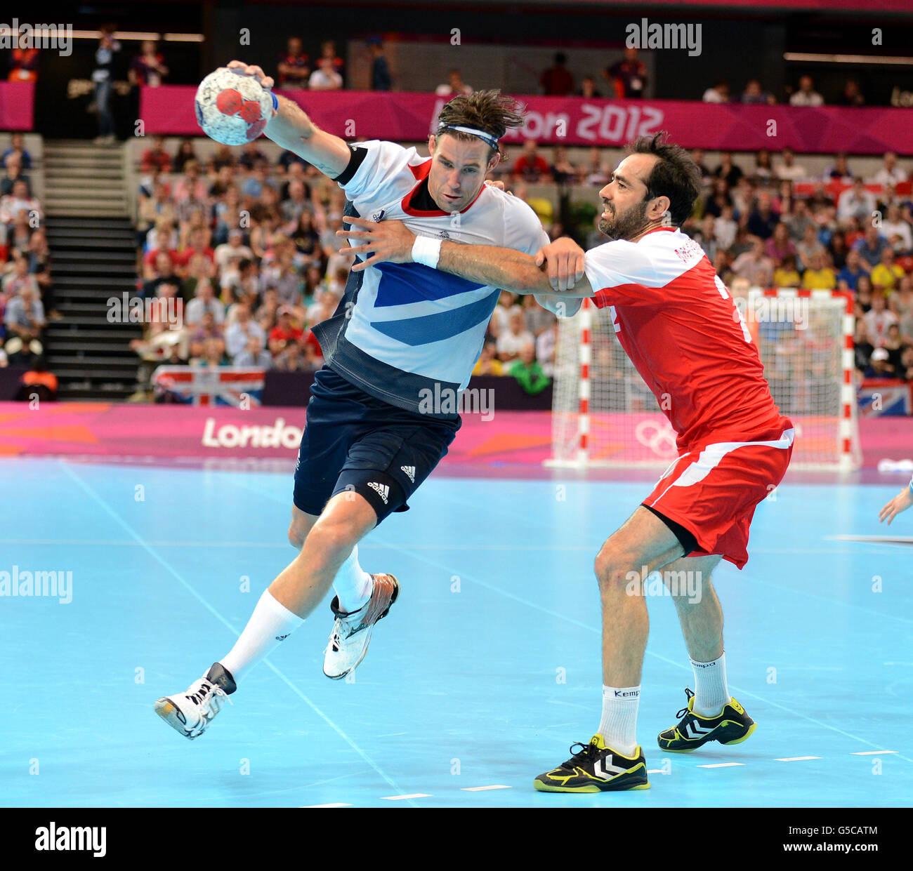Great Britain's Steven Larsson and Tunisia's Heykel Megannem in action ...
