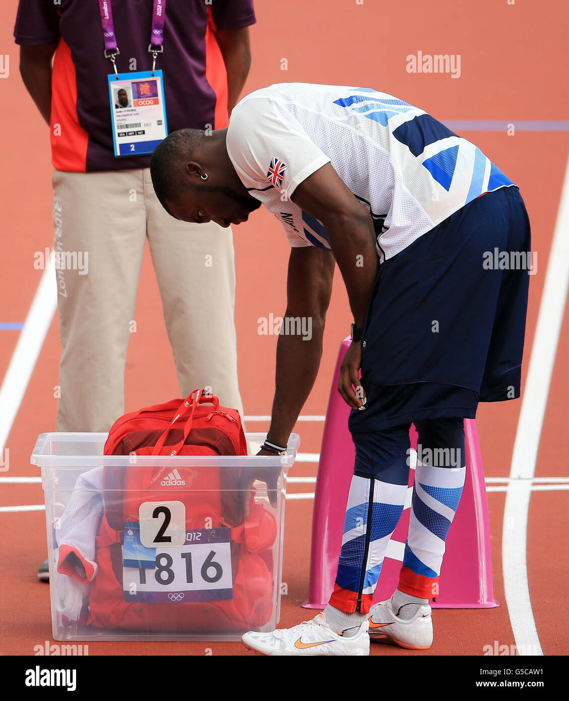 Great Britain's Nigel Levine receives his kit before the Men's 400m ...