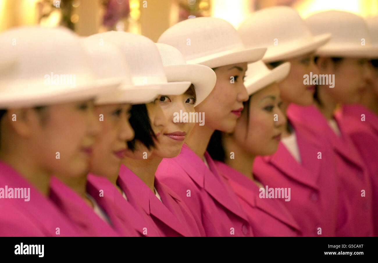 London dressed in pink uniforms hi-res stock photography and images - Alamy