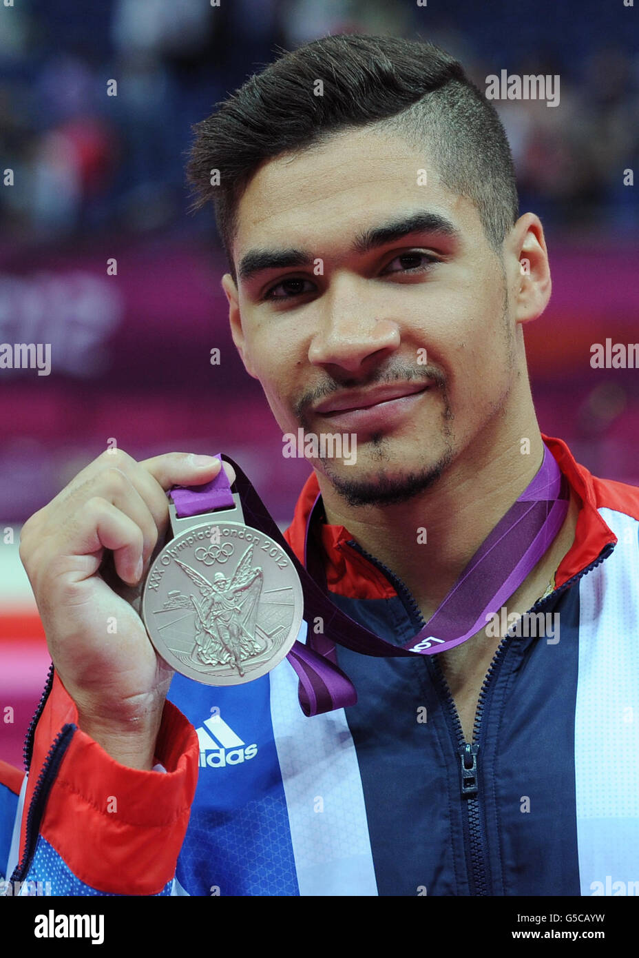 Great Britain's Silver medalist Louis Smith celebrates with his medal ...