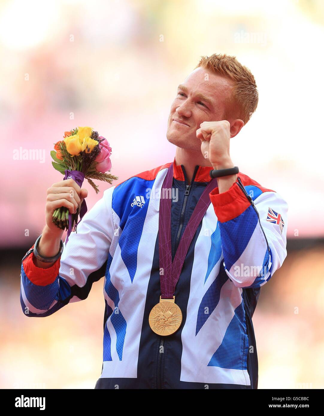 Great Britain's Greg Rutherford receives his gold medal for the mens ...