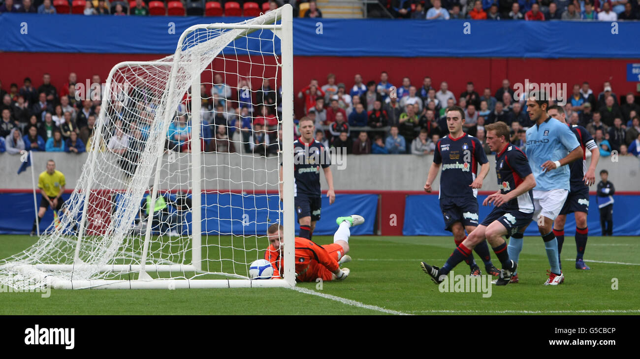 Limerick's goalkeeper Dave Ryan watches Manchester City's Edin Dzeko's ...