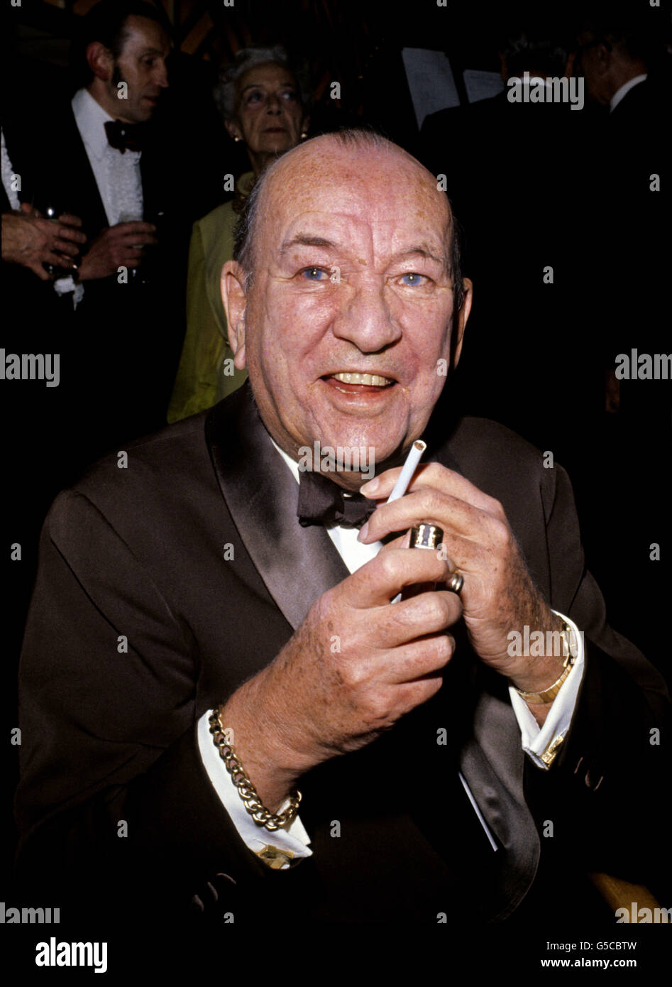 NOEL COWARD 1969: Actor and playwright Noel Coward lights a cigarette ...