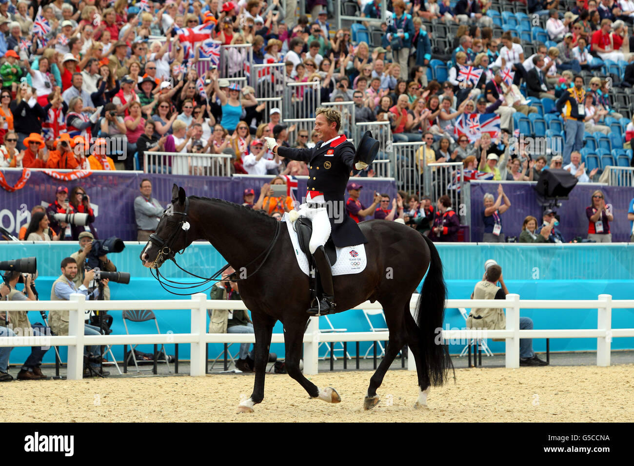Great Britain's Carl Hester riding Uthopia after completing her test in ...