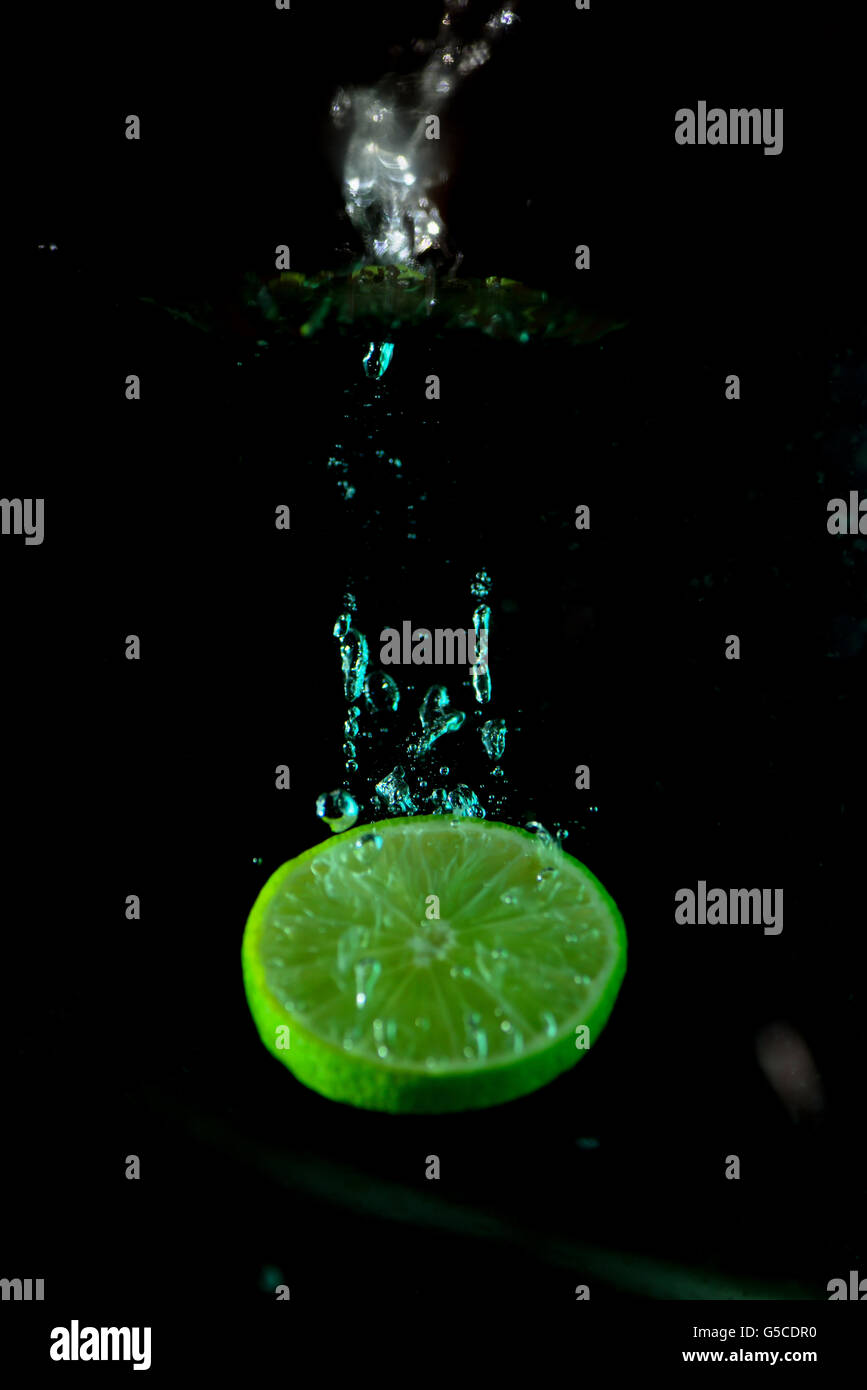 Fresh lime with water splash Stock Photo - Alamy