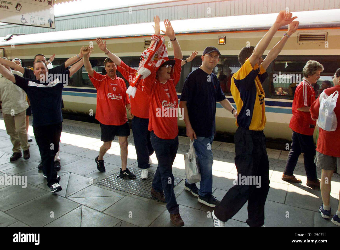 Sport football fans train arms raised football shirt hi-res stock ...