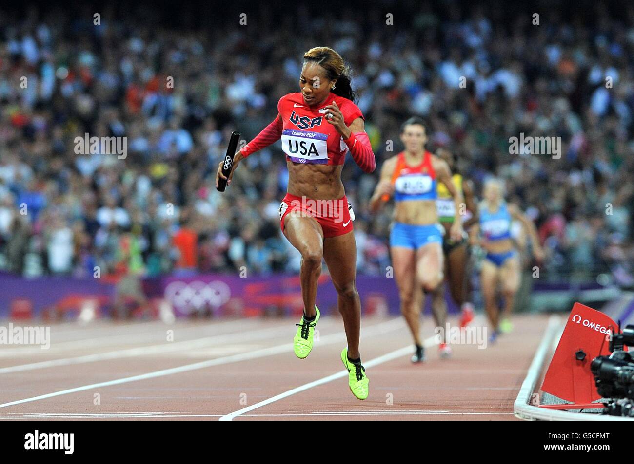 USA's Sanya Richards-Ross celebrates her team's victory as she crosses ...