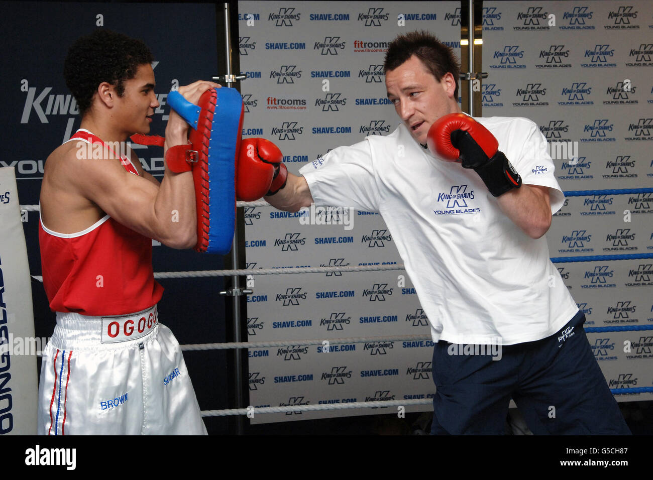 England footballer John Terry (right) spars with young boxer Anthony ...