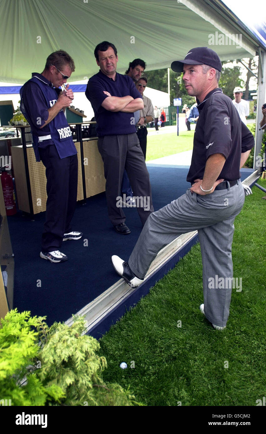 Scotland's Dean Robertson waits for a rules official after hitting his ...