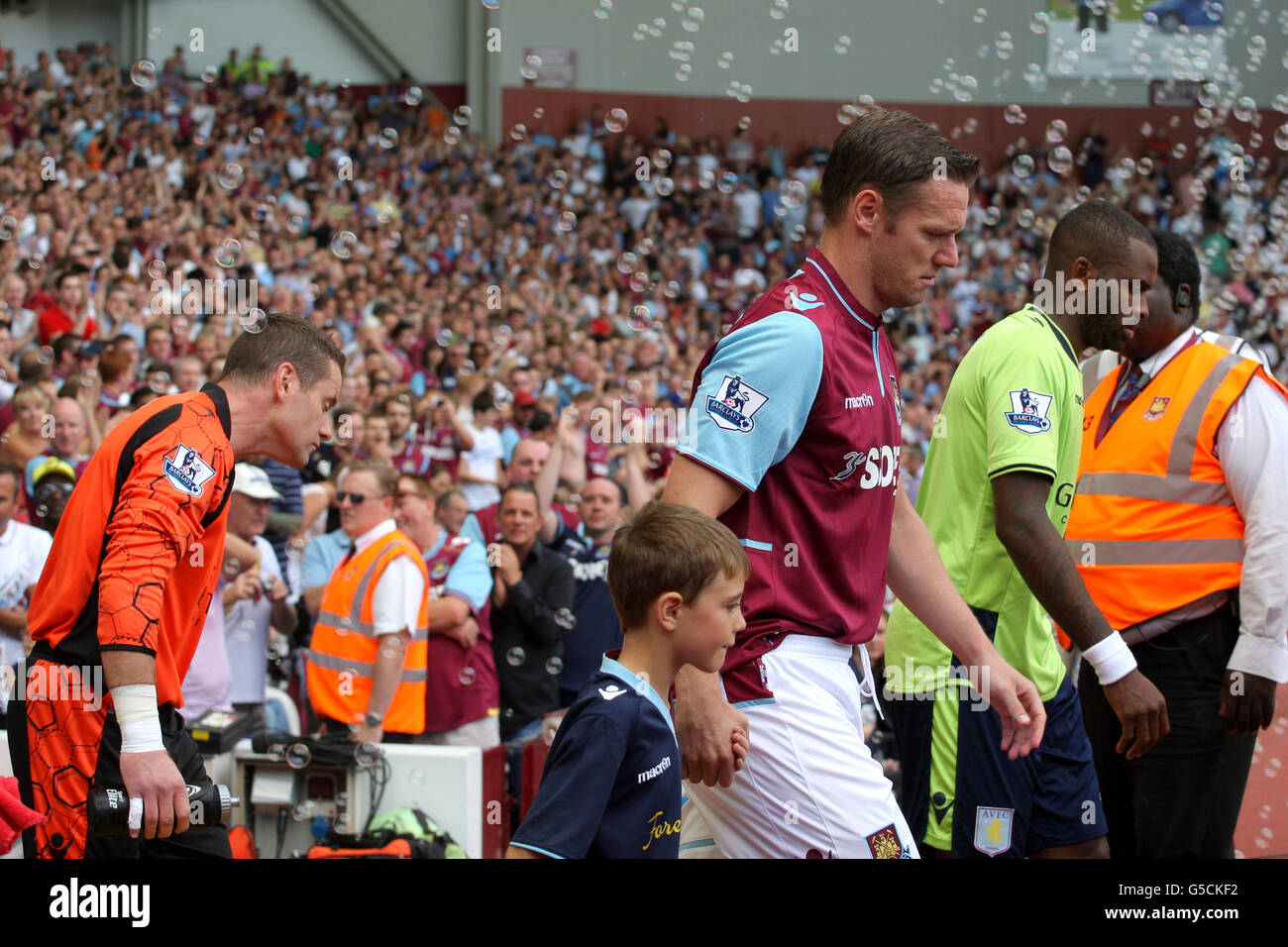 West Ham United captain Kevin Nolan leads his team out before kick off ...
