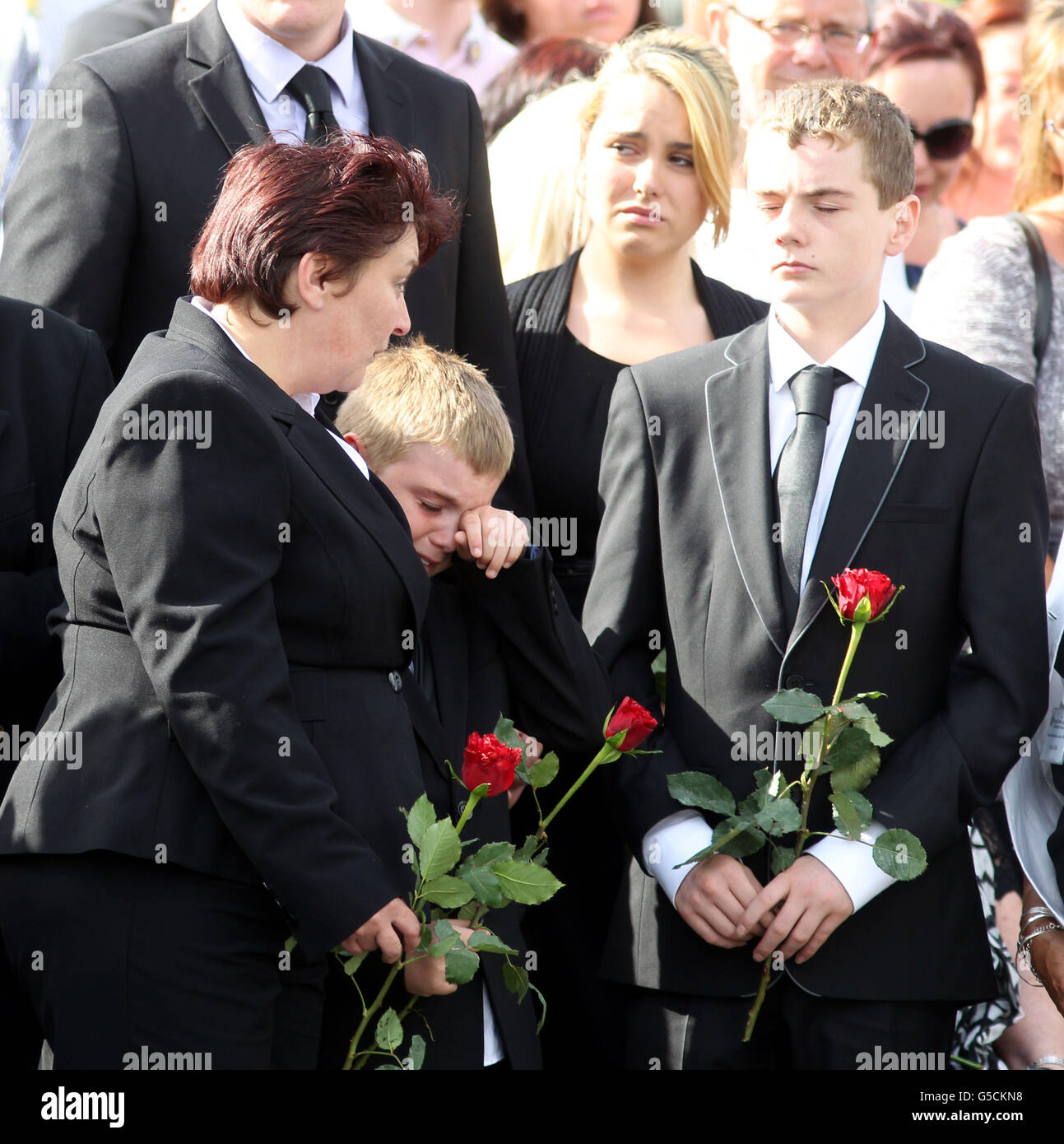 Friends and family wait to lay flowers on the hearses of, Lieutenant ...