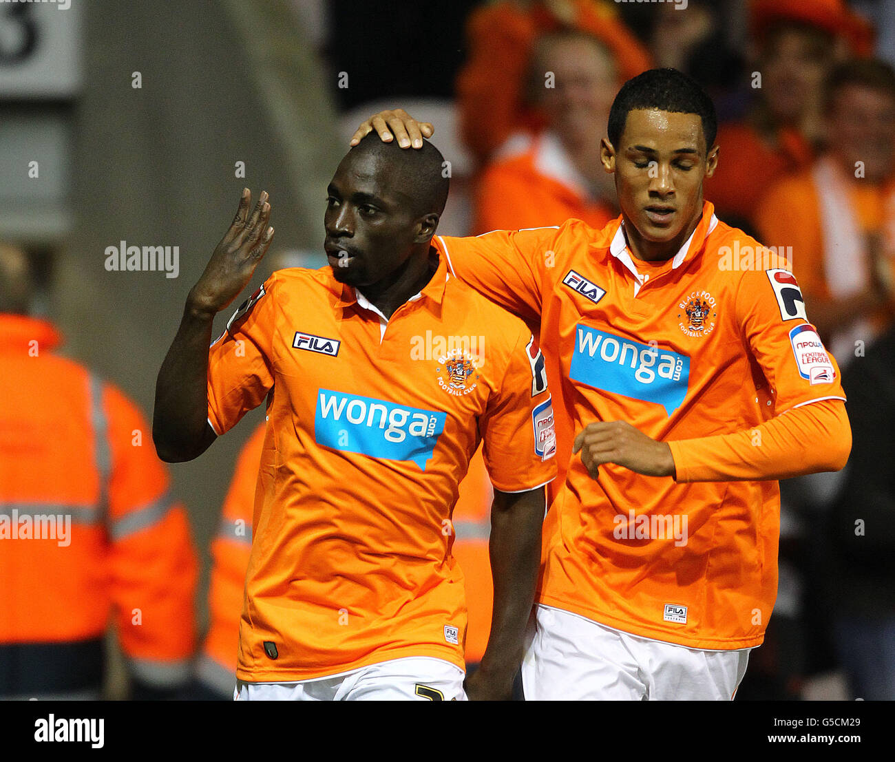 Blackpool's Nouha Dicko (left) celebrates with team-mate Thomas Ince ...