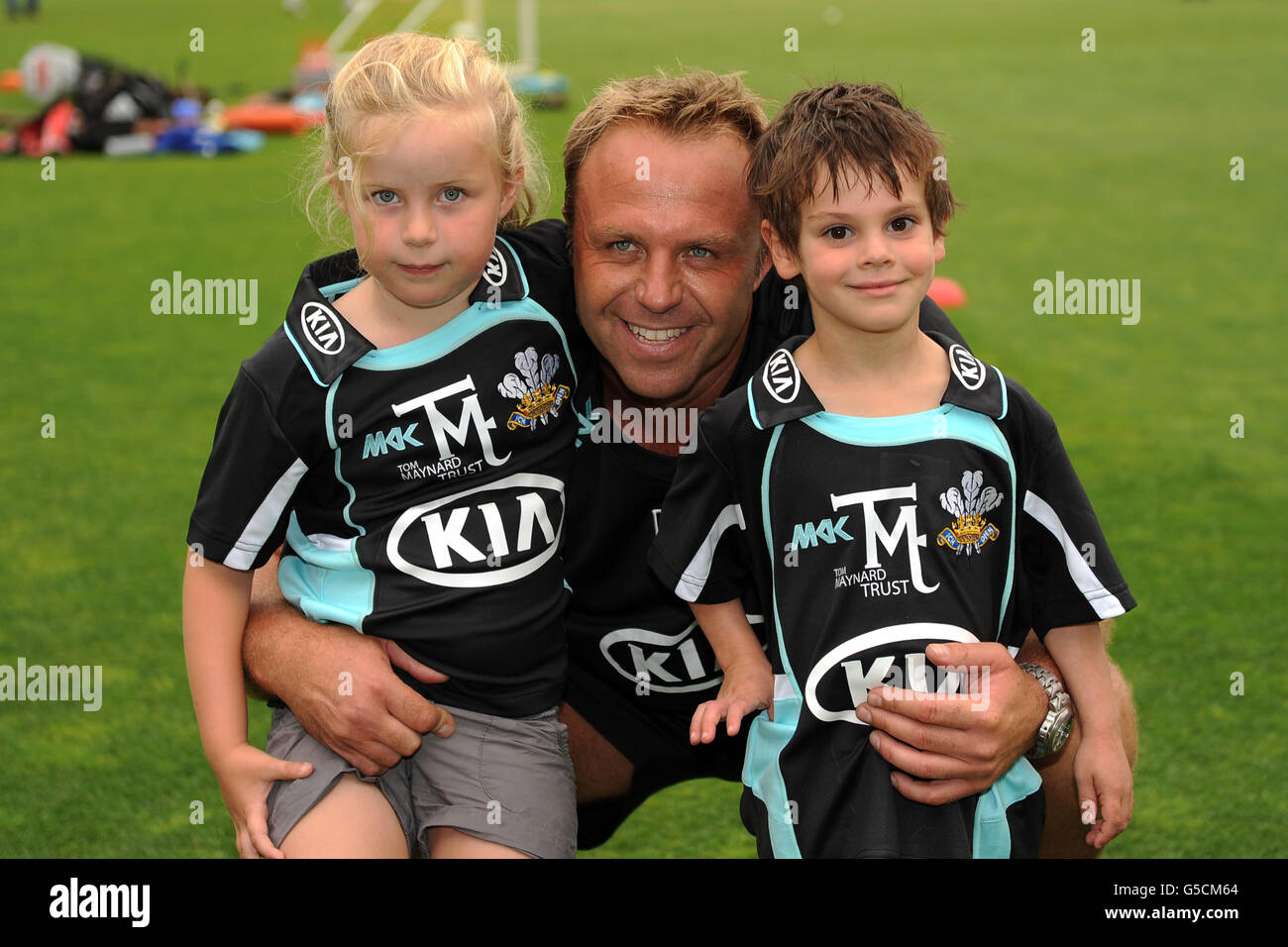 Surrey head coach Chris Adams with Surrey mascots Tyler De Bruyn and ...