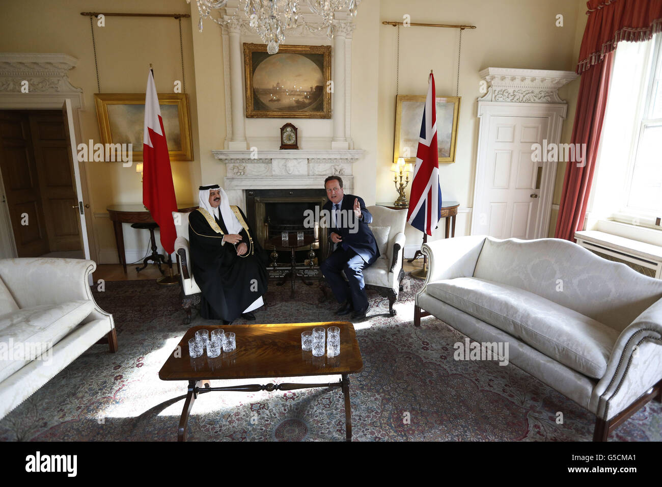 Britain's Prime Minister David Cameron, right, greets King Hamad bin ...