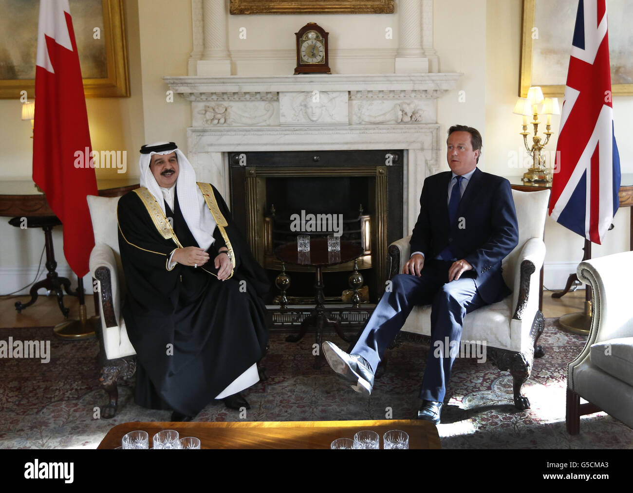 Britain's Prime Minister David Cameron, right, greets King Hamad bin ...