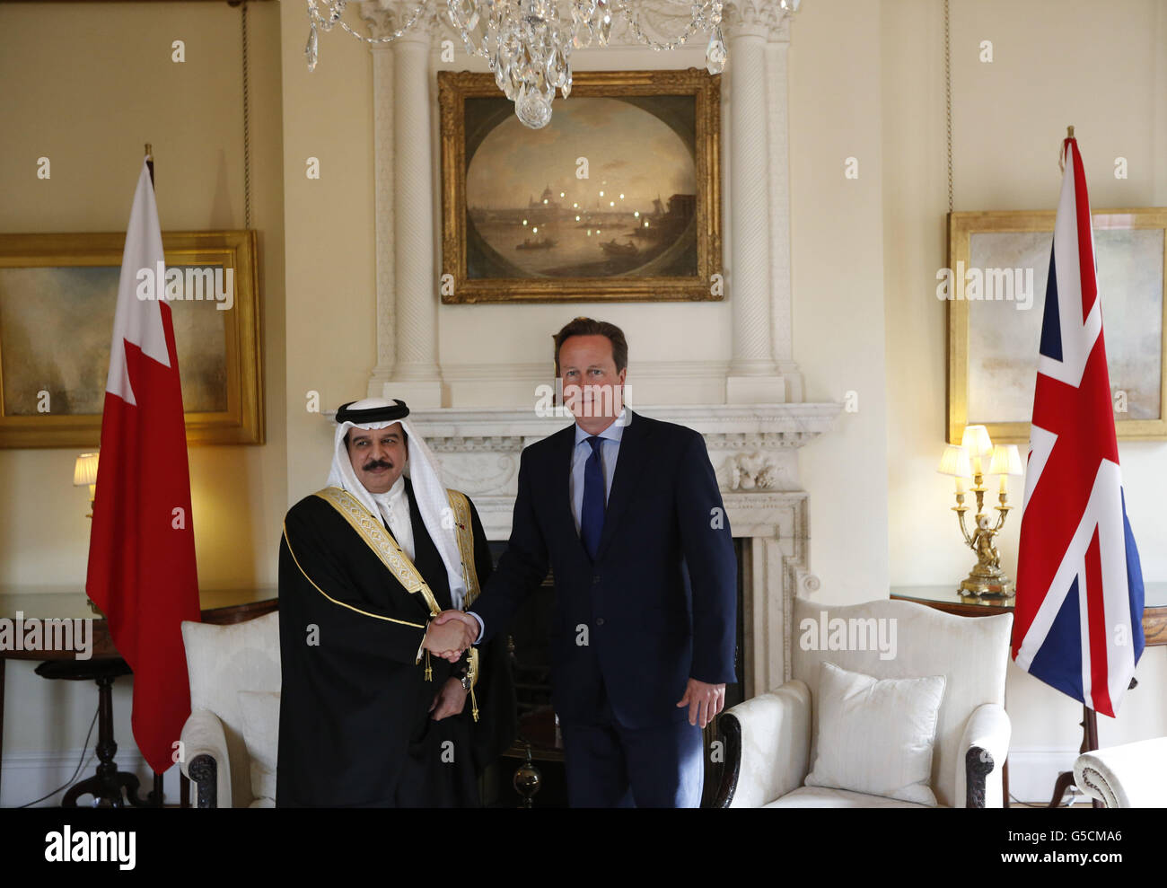 Britain's Prime Minister David Cameron, right, greets King Hamad bin ...