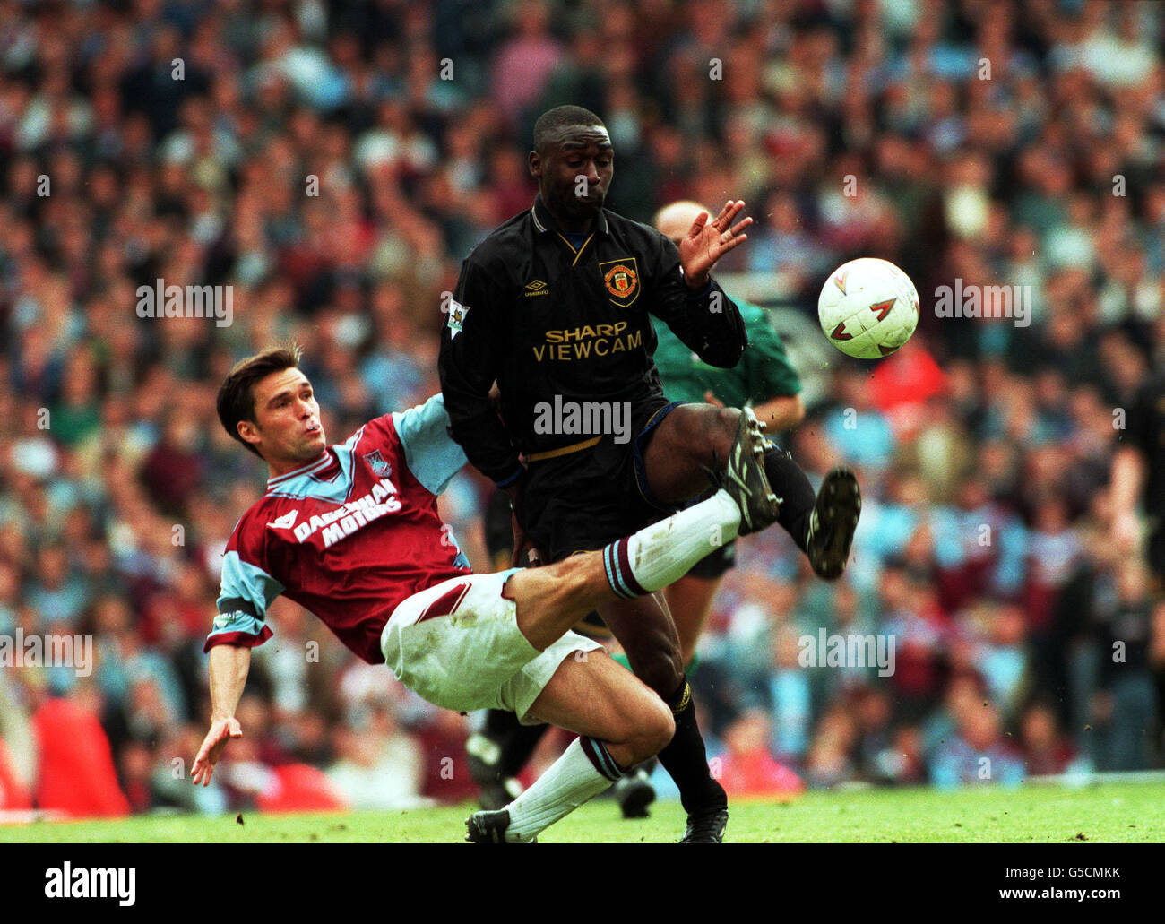 West Ham's Steve Potts gains control of the ball from Manchester United ...