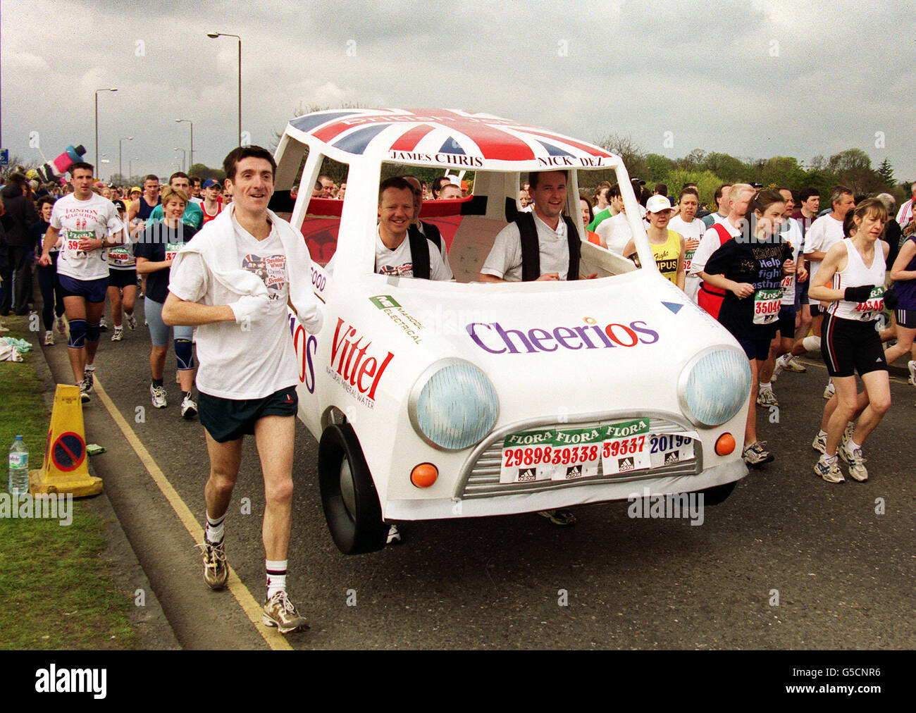 Runners wear a model car as they run across Blackheath. 30,000 runners ...